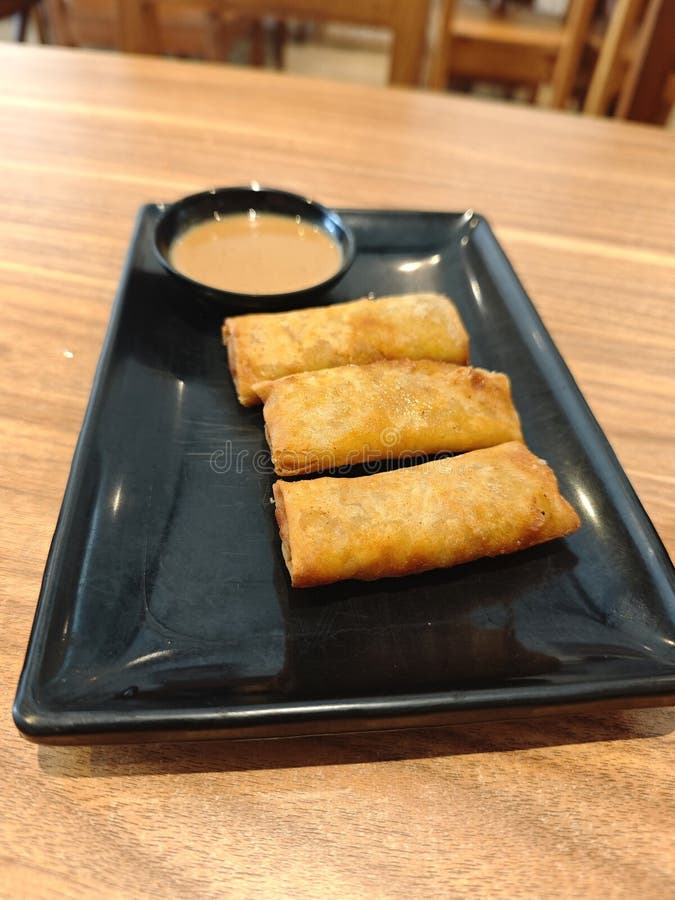A Rectangle Black Plate of Seafood Spring Roll Stock Photo - Image of ...