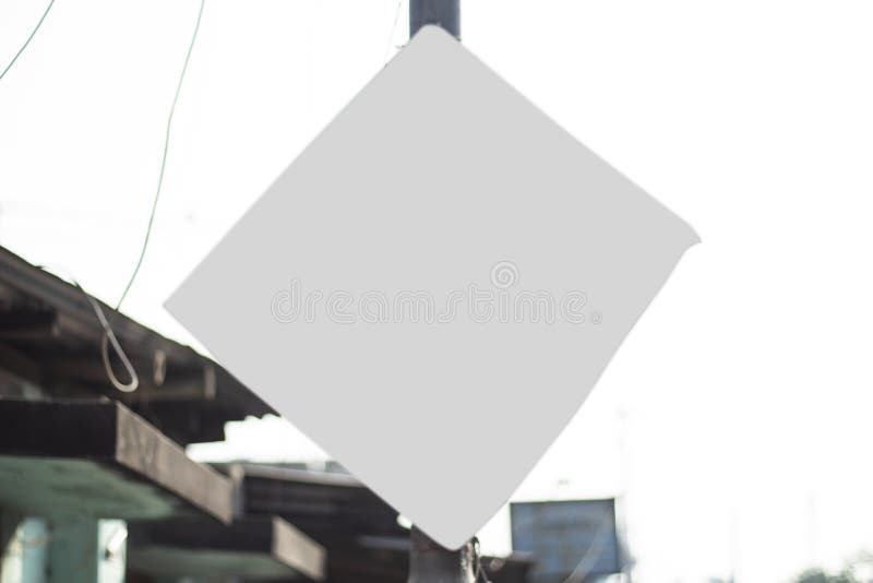 A Rectangle Grey Blank Signboard Hanging in Front of a Shop and the ...