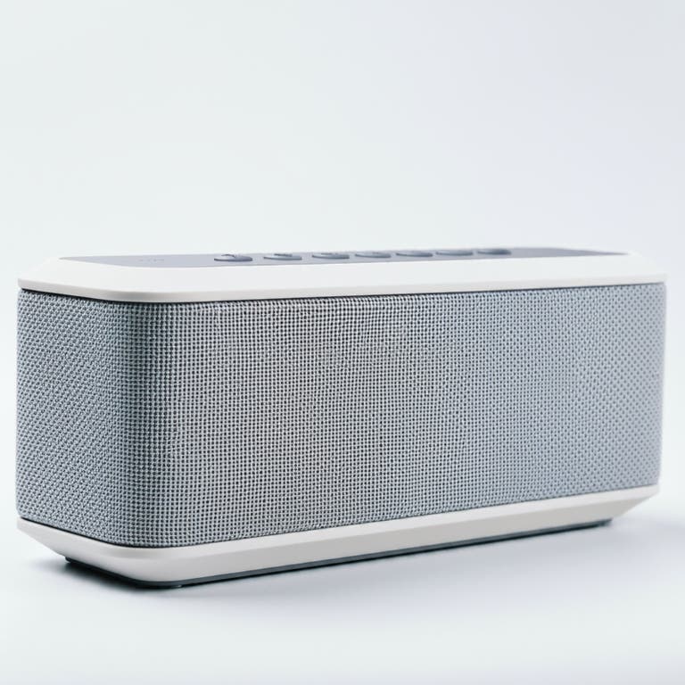 Rectangular Bluetooth Speaker with a Minimalist Design. it Features a ...