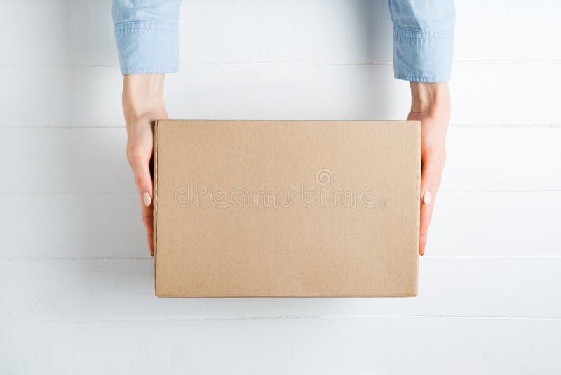 Rectangular Cardboard Box in Female Hands. Top View, White Background ...