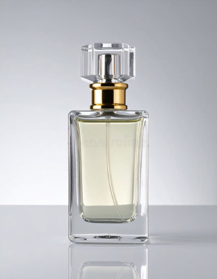 Rectangular Clear Glass Perfume Bottle with Golden Accents on a ...