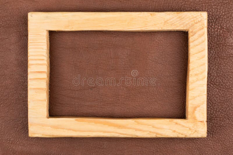 Rectangular Frame Made from Light Wood Lies on Brown Natural Leather ...