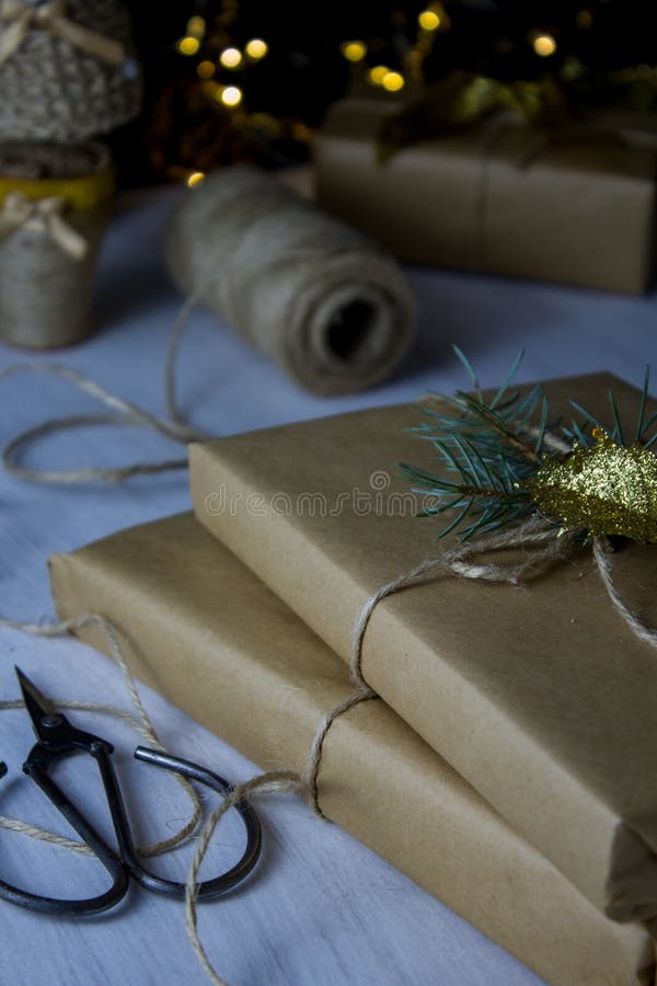 Rectangular Gifts in Craft Packaging with Jute Thread on the Table ...