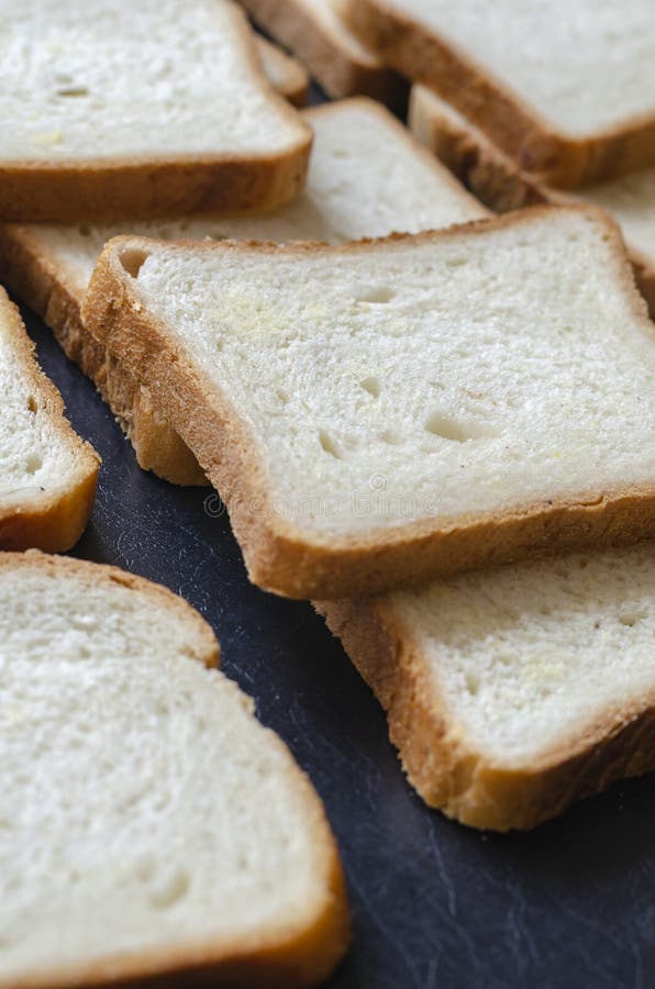 Rectangular Pieces of Bread Pile on the Table Stock Photo - Image of ...