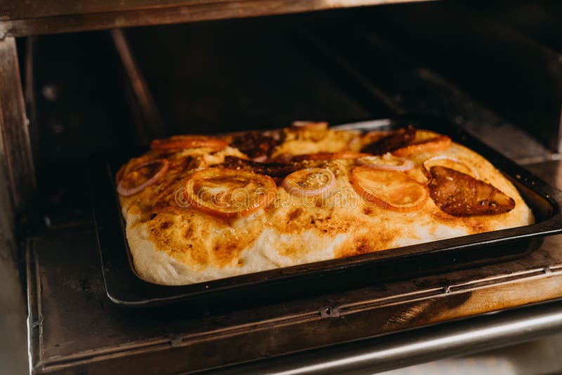 Rectangular Pizza with Onions, Tomatoes and Meat on a Pan Stock Image ...