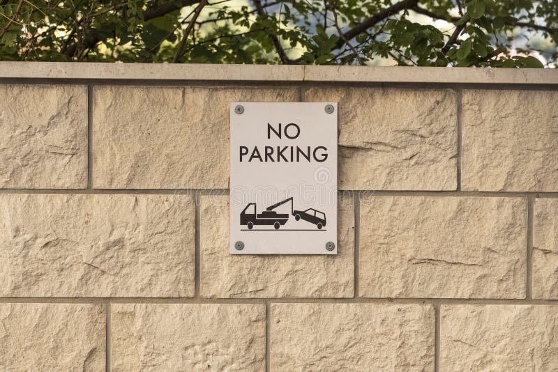 A Rectangular Plaque on the Stone Wall Signifying a Ban on Parking ...