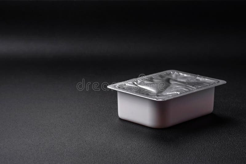 Rectangular Plastic Box with Yogurt or Cheese Hermetically Sealed with ...