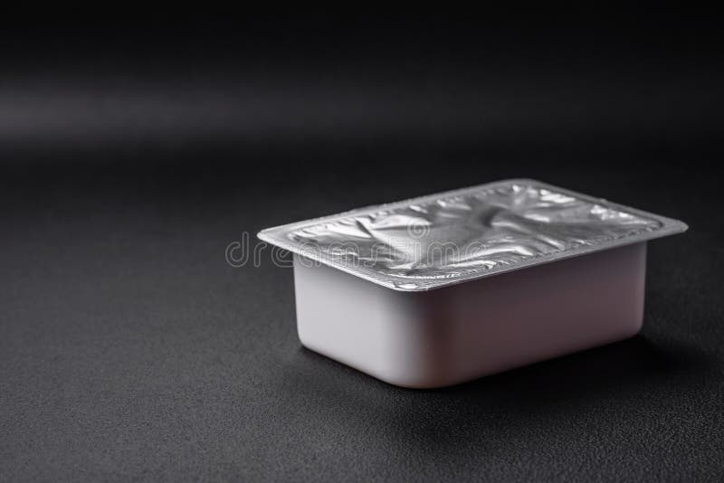 Rectangular Plastic Box with Yogurt or Cheese Hermetically Sealed with ...