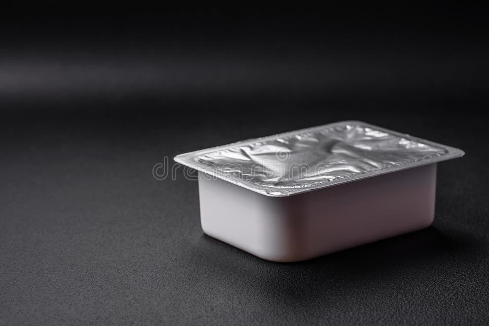 Rectangular Plastic Box with Yogurt or Cheese Hermetically Sealed with ...
