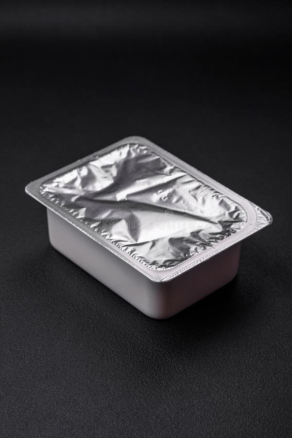 Rectangular Plastic Box with Yogurt or Cheese Hermetically Sealed with ...