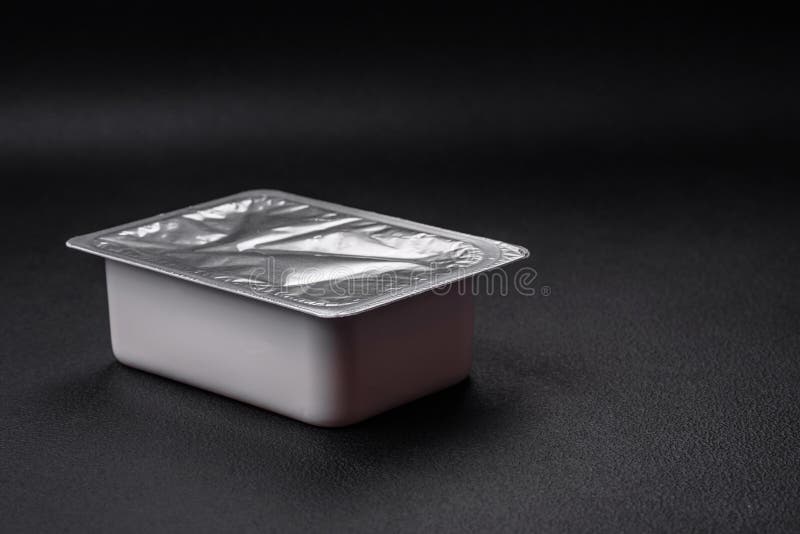 Rectangular Plastic Box with Yogurt or Cheese Hermetically Sealed with ...