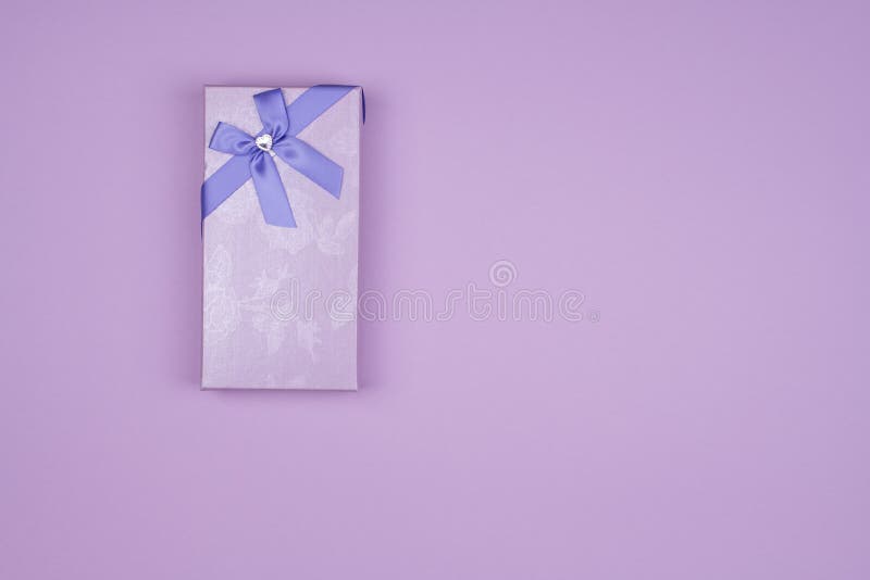 Rectangular Purple Gift Box with Bow on Purple Background, Top View ...