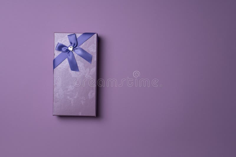 Rectangular Purple Gift Box with Bow on Purple Background, Top View ...