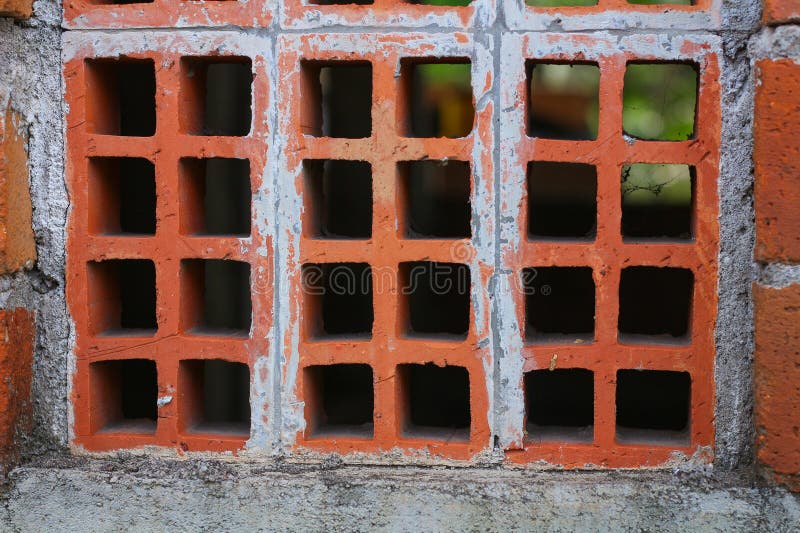 Rectangular Red Bricks are Arranged with Square Holes, Forming a ...