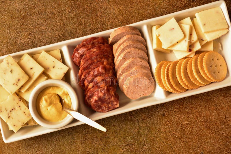 Rectangular Serving Plate of Cheese, Crackers, Meats, and Mustard ...