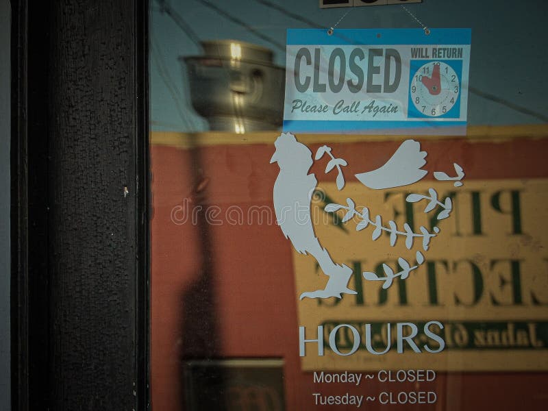 Rectangular-shaped Closed Sign and a Rooster Sticker in a Window Stock ...