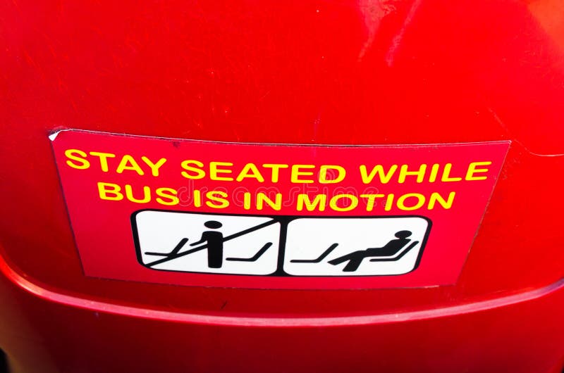 Rectangular Sign on a Glossy Red Surface Requesting To Remain Seated ...