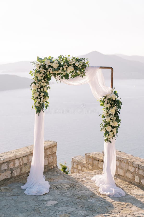 Rectangular Wedding Arch Covered with a White Cloth Stands on an ...