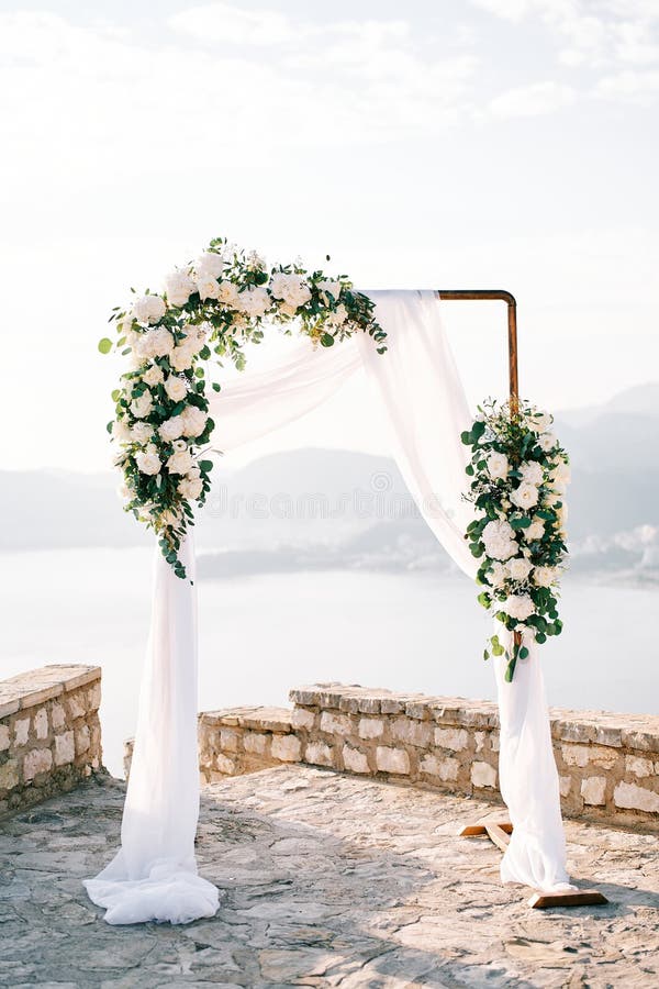 Rectangular Wedding Arch Covered with a White Cloth Stands on an ...