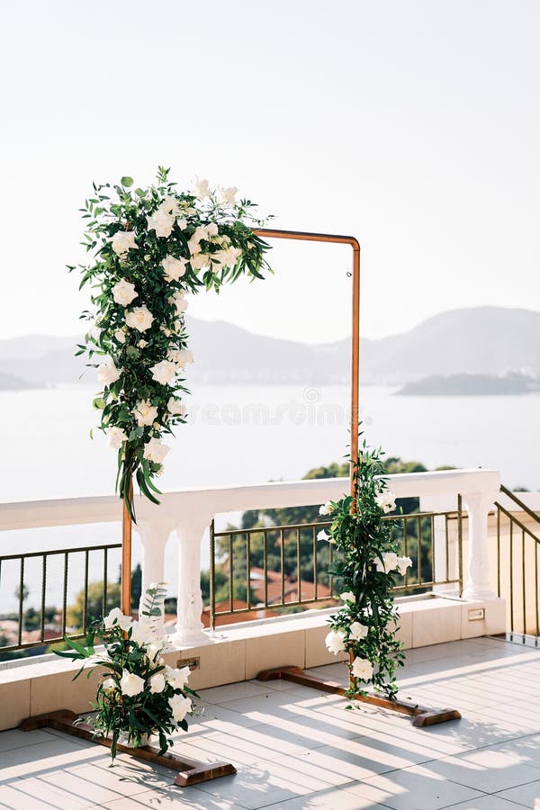 Rectangular Wedding Arch Stands on a Terrace Above the Sea Against the ...