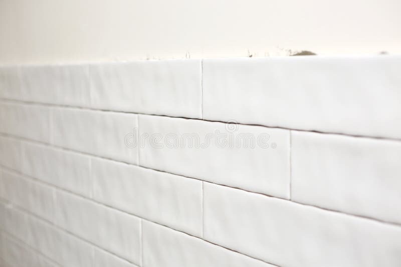 Rectangular White Ceramic Tile on the Kitchen Wall. Repairs in the ...