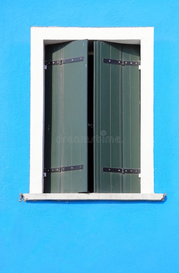 Rectangular Window with Closed Shutters and Light Blue Wall Stock Image ...