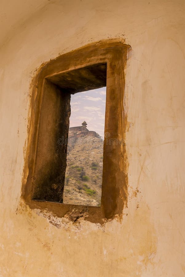 A Rectangular Window with a View Towards the Mountain Top ...