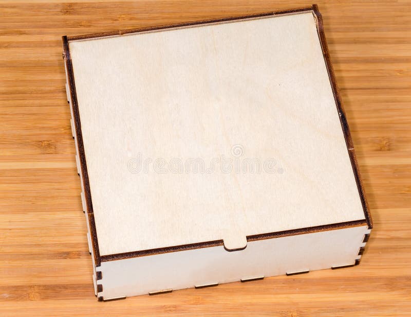 Rectangular Wooden Box with Closed Lid on a Wooden Surface Stock Image ...