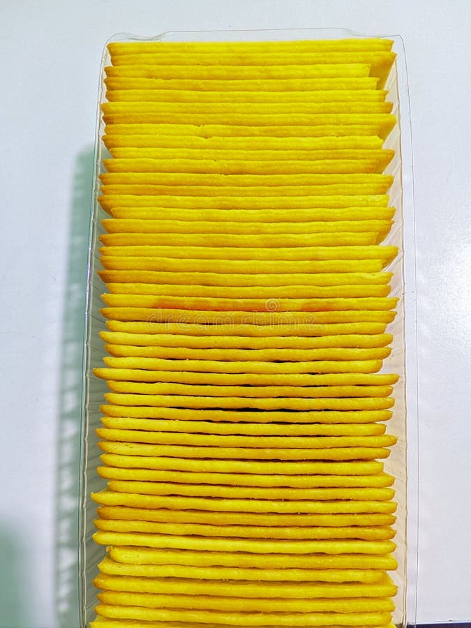 Rectangular Yellow Crackers are Neatly Stacked in Transparent Plastic ...