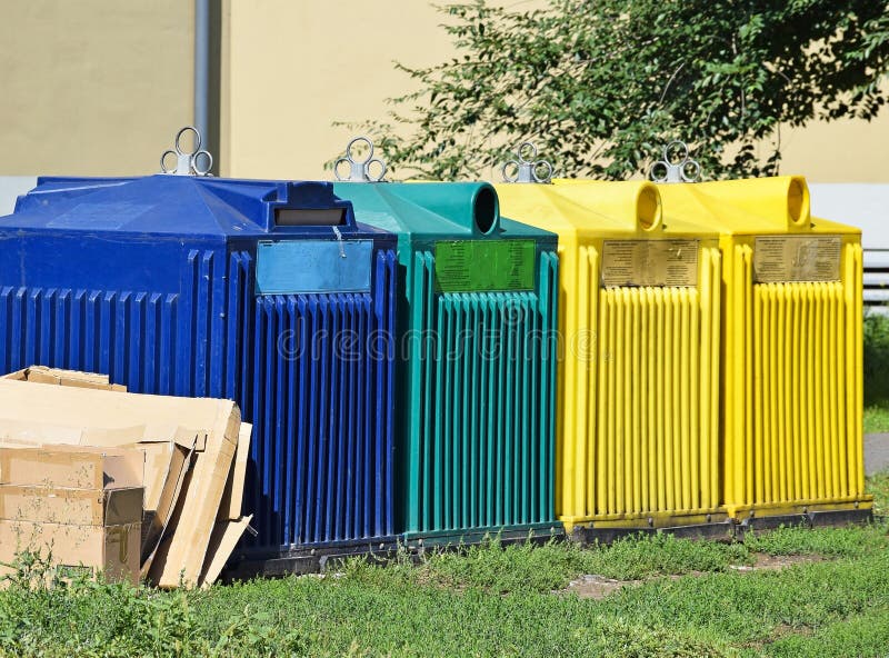 Recycle garbage cans stock image. Image of grass, yellow - 81900773
