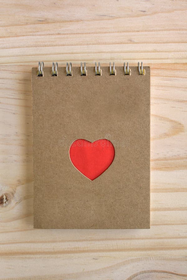 Recycle Notebook with Red Heart Shape on Wooden Desk Stock Photo ...