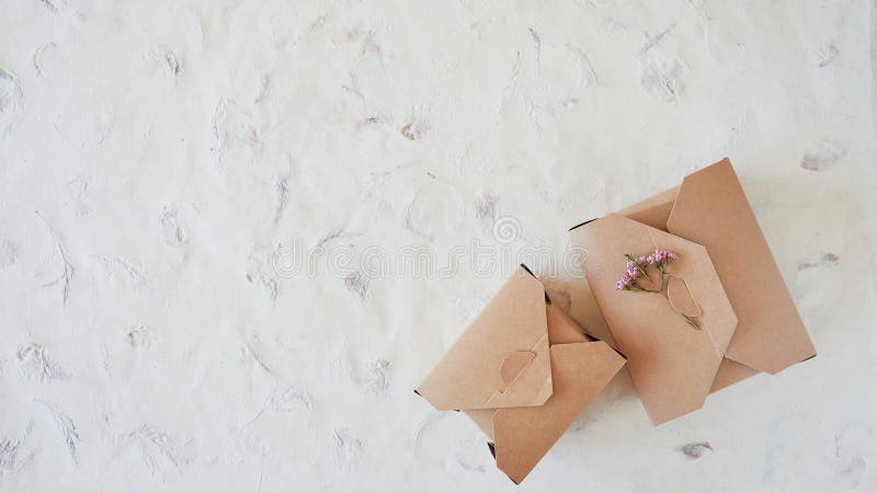 Recycled Paper Gift Boxes Decorated with a Small Sprig of Flowers Stock ...
