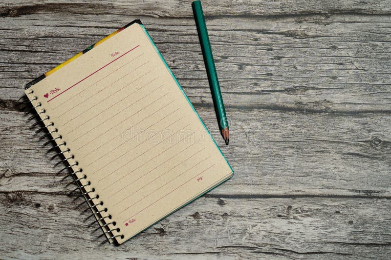 Recycled Paper Notebook Open on a Clean Sheet on a Board with a Pencil ...