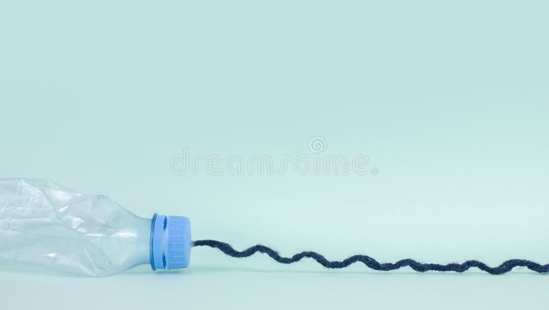 Recycled Polyester Concept. a Plastic Bottle Turns into a Thread Stock ...