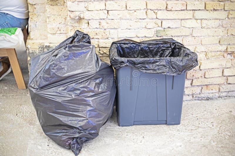 Recycling Bag Next To a General Waste Bin. Stock Image - Image of ...
