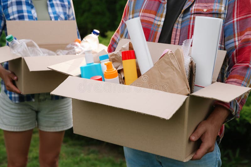 Recycling. People Holding Cardboard Boxes with Different Garbage ...