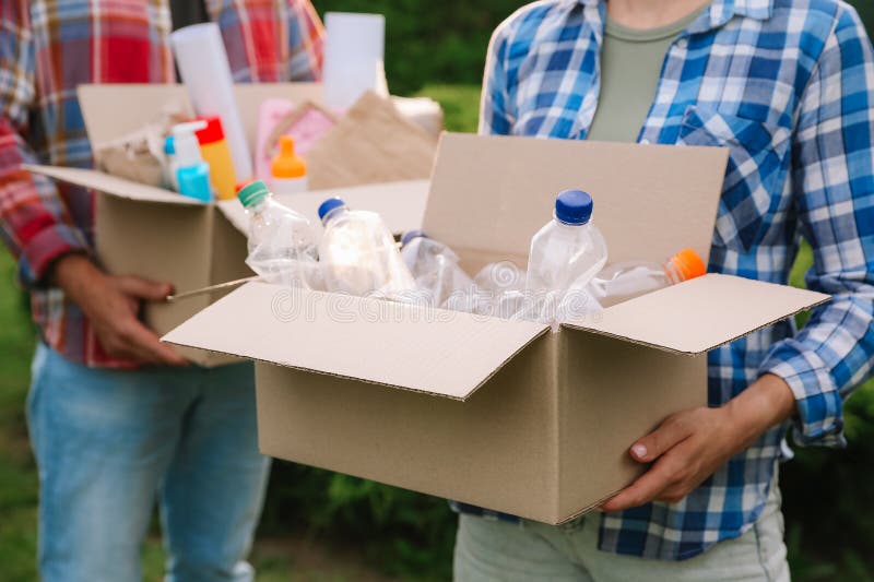 Recycling. People Holding Cardboard Boxes with Different Garbage ...
