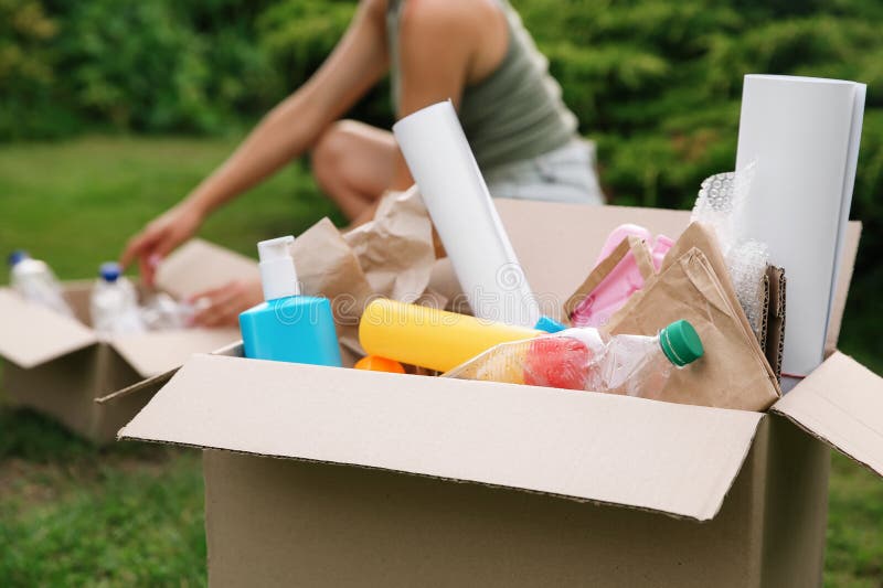 Recycling. Woman Near Cardboard Box with Different Garbage Outdoors ...