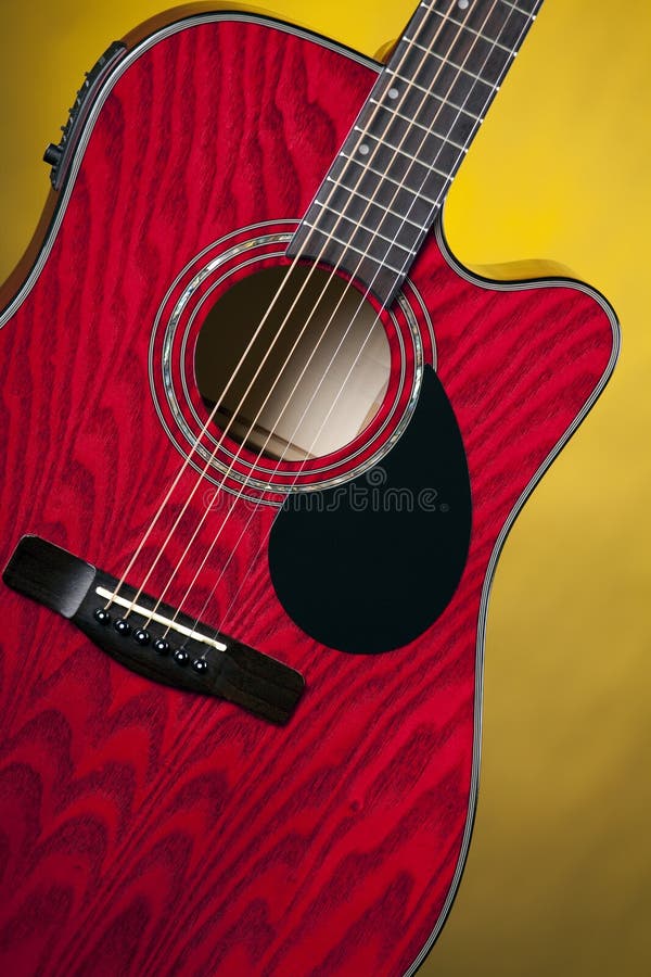 Red Acoustic Guitar on Yellow Stock Photo - Image of yellow, strings ...