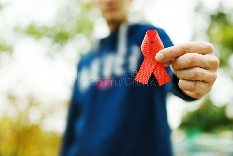 AID Red Ribbon in Hand on a Black Wooden Background.black and White ...