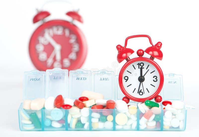 Red Alarm Clock and Medicine in Weekly Pill Box Stock Image - Image of ...