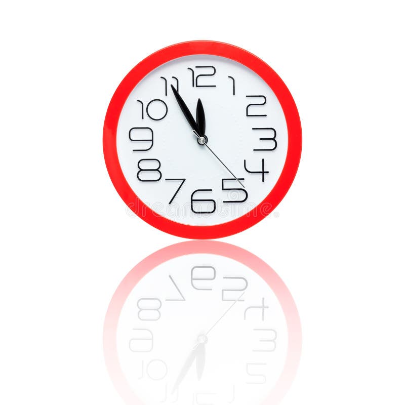 Red Alarm Clock Showing Five Minutes To Midnight with Reflection Stock ...