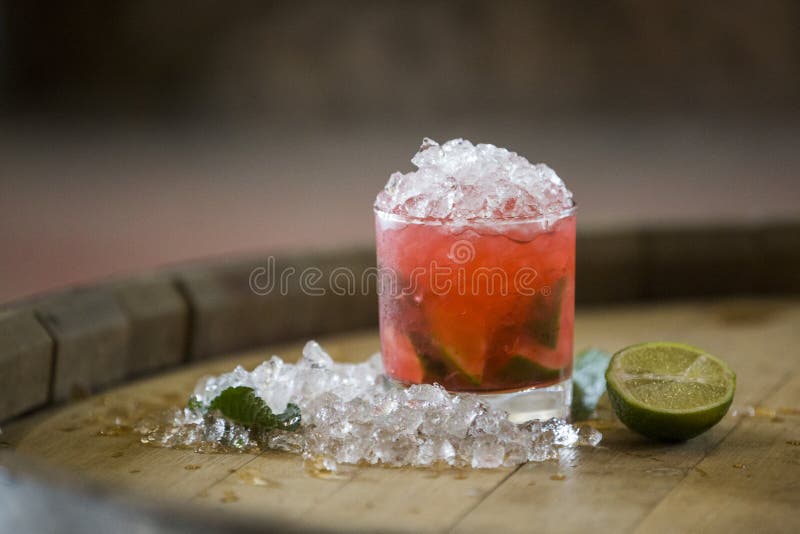 Closeup Shot of a Glass of Red Alcohol Cocktail on a Wooden Barrel ...