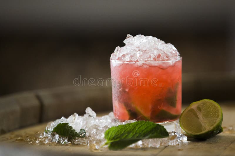 Closeup Shot of a Glass of Red Alcohol Cocktail on a Wooden Barrel ...