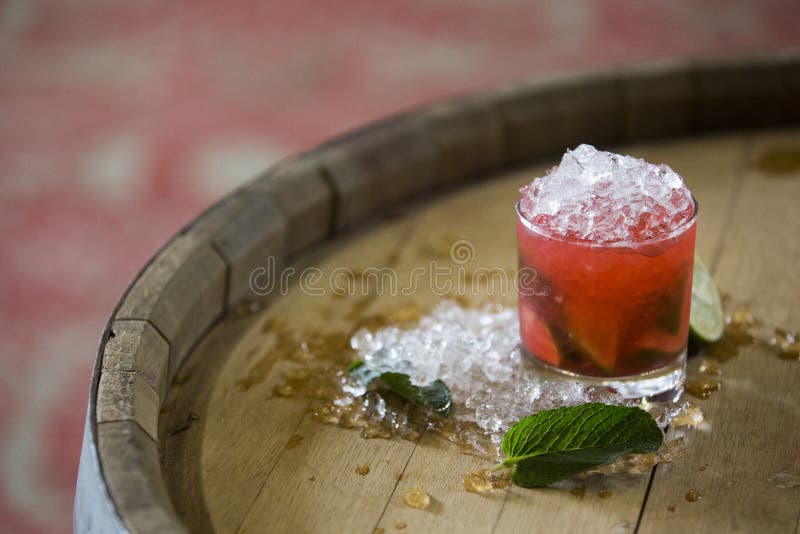 Closeup Shot of a Glass of Red Alcohol Cocktail on a Wooden Barrel ...