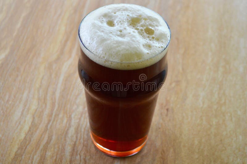 A Glass of Beer on the Table Stock Photo - Image of lager, beverage ...