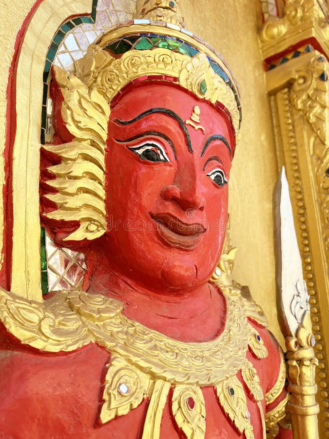 Red Angle Statue on Golden Wall Stock Image - Image of angle, buddhist ...