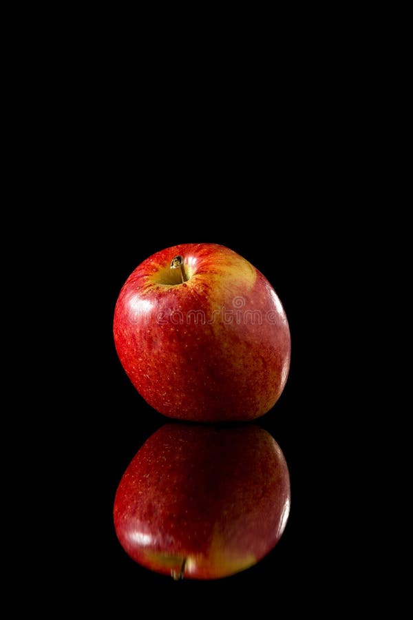 Red Apple on a Black Reflective Background Stock Photo - Image of ...