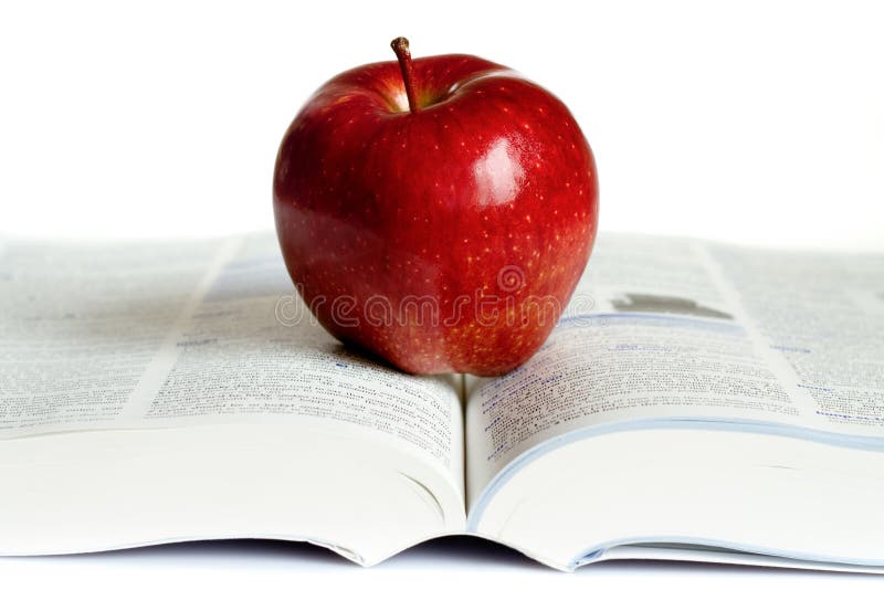 A red apple on a book stock image. Image of library, healthy - 17970643