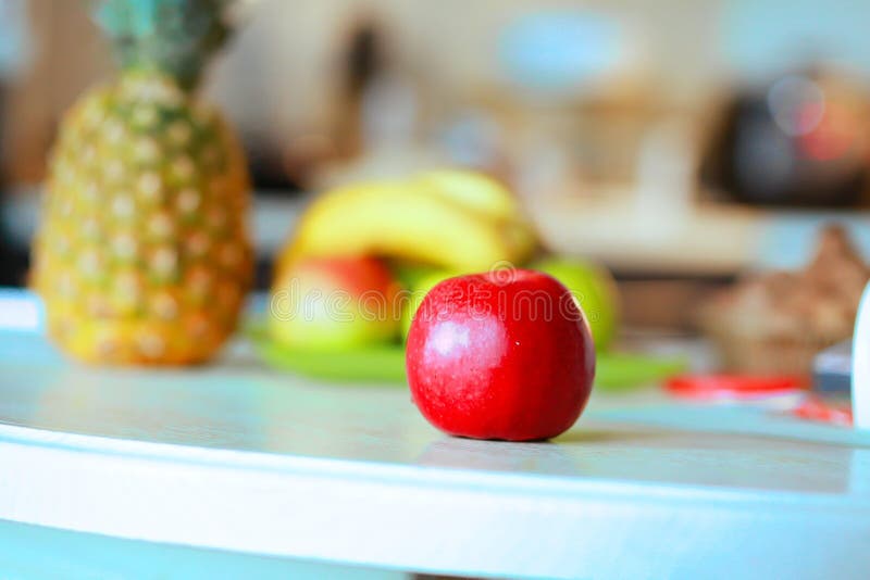 Red Apple, Diverse Fruits on a Table in a Modern Kitchen. Useful ...